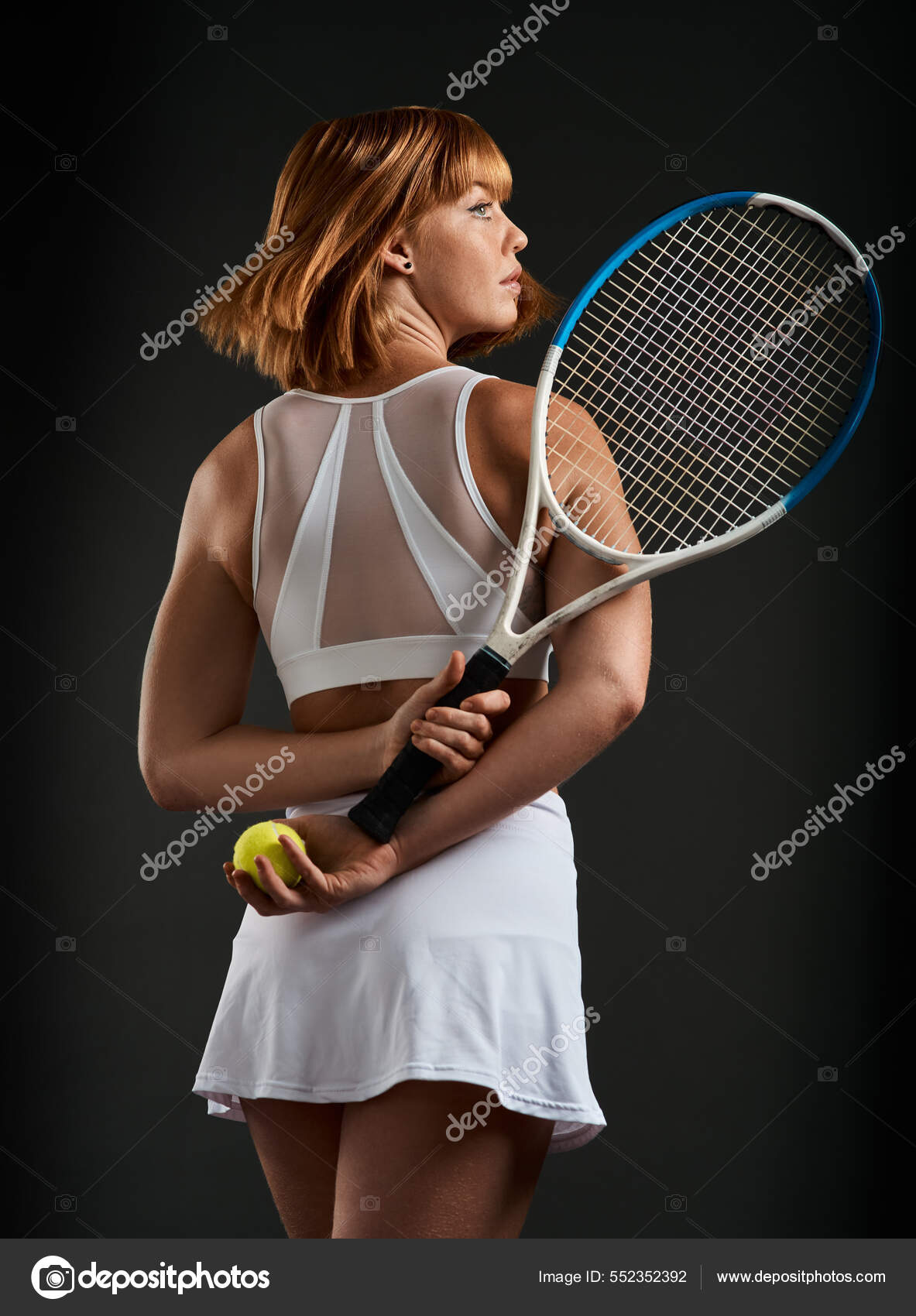 Tennis is more than just a sport. Cropped shot of a woman posing with a ...