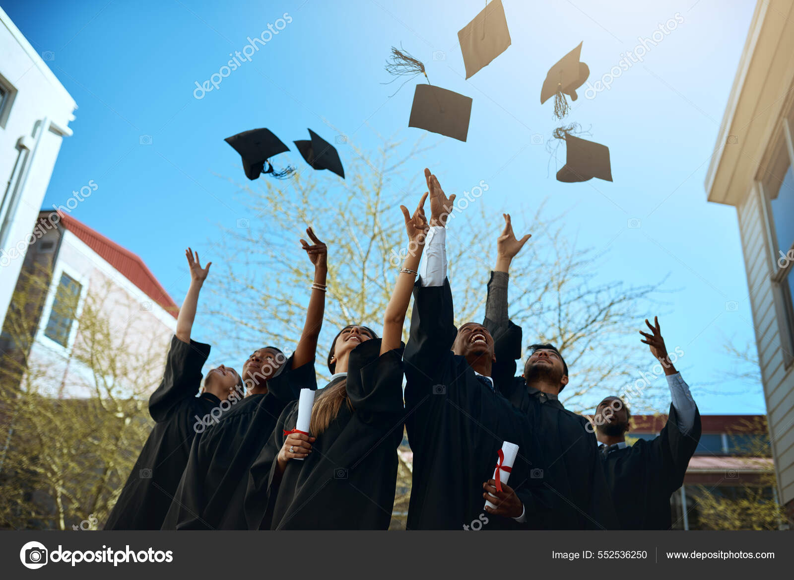Goodbye college, hello career. Shot of a group of young students ...