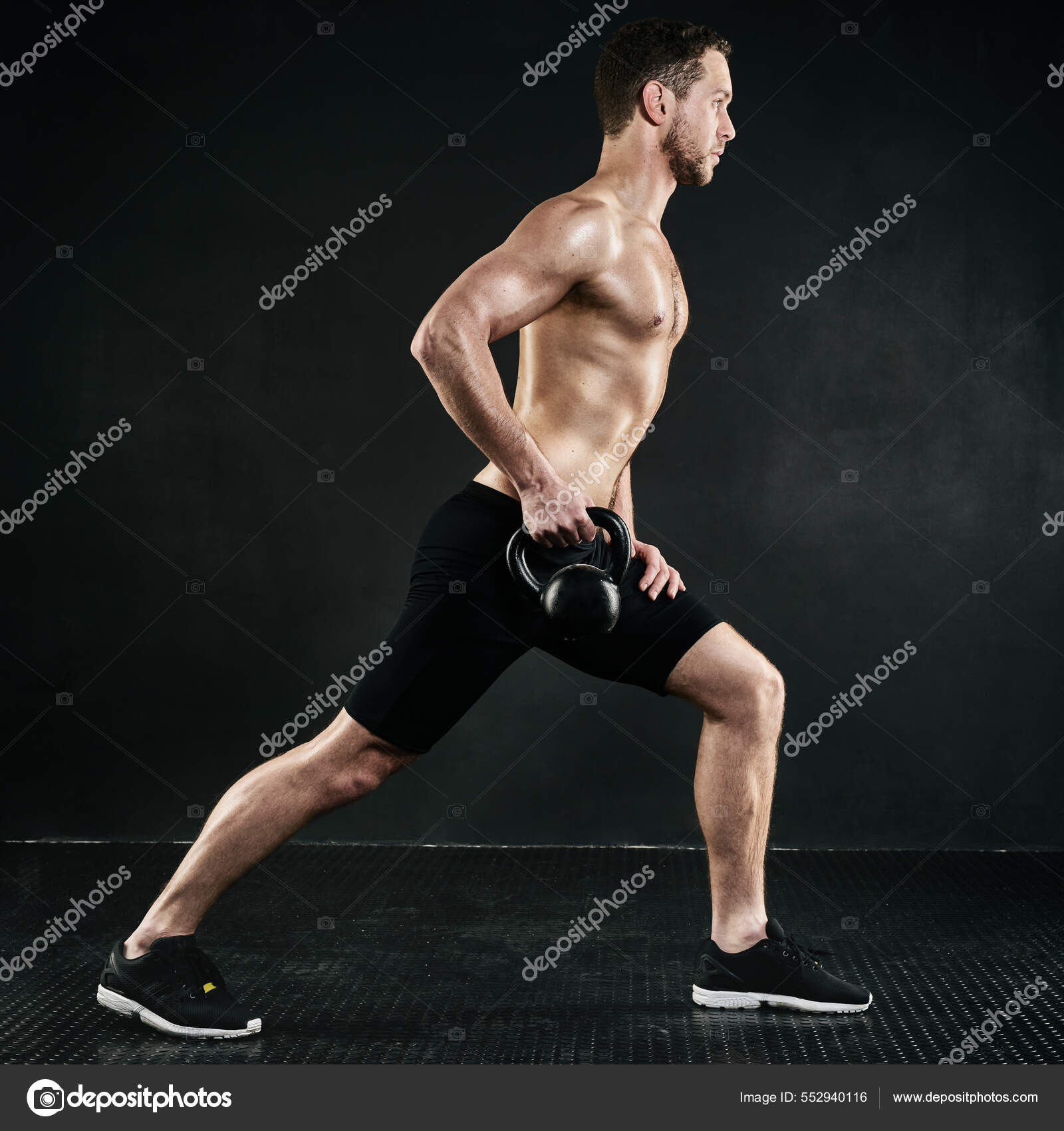Getting a full body workout. Studio shot of a shirtless young man ...