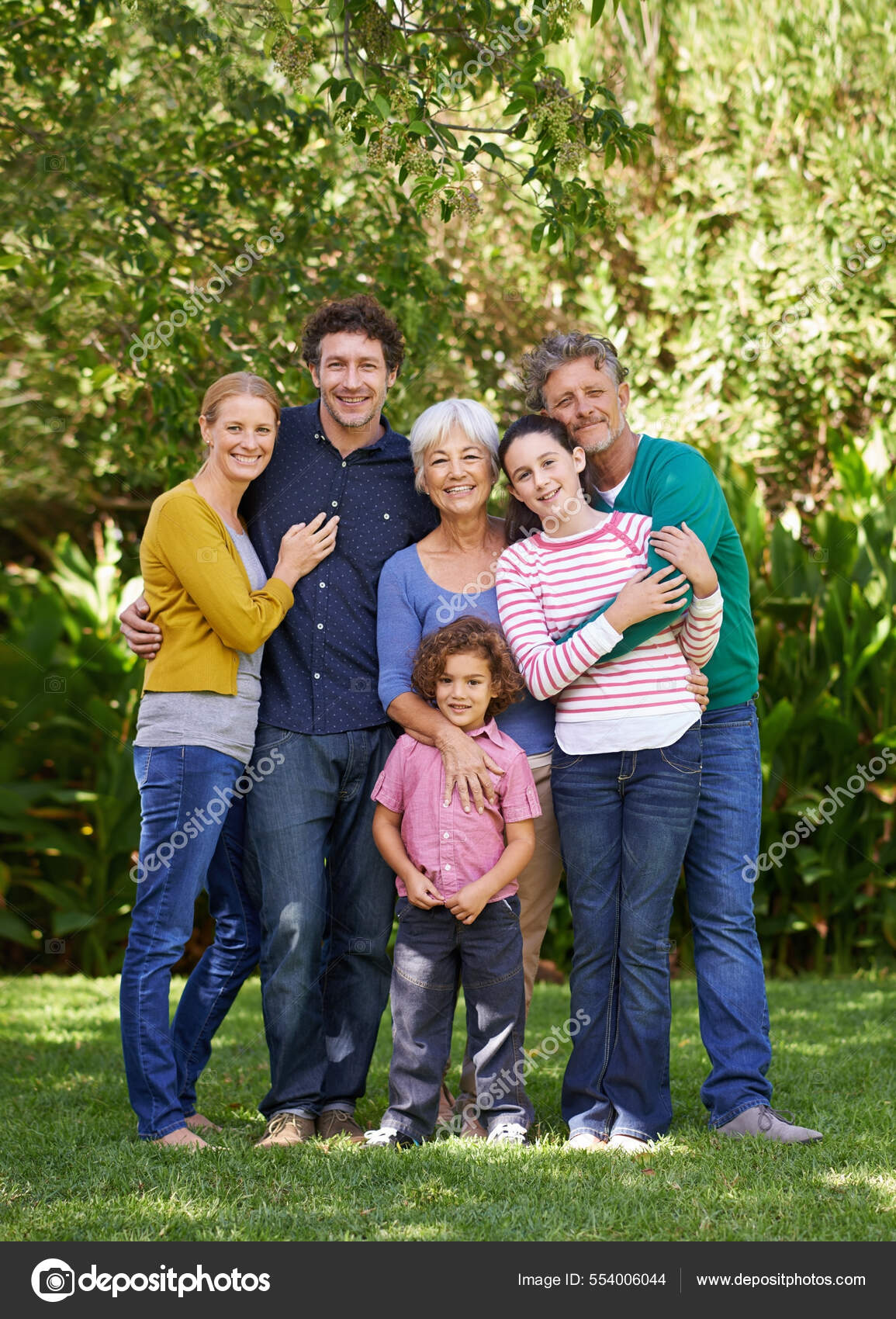 Family always comes first. Shot of a family posing for a photo. Stock ...