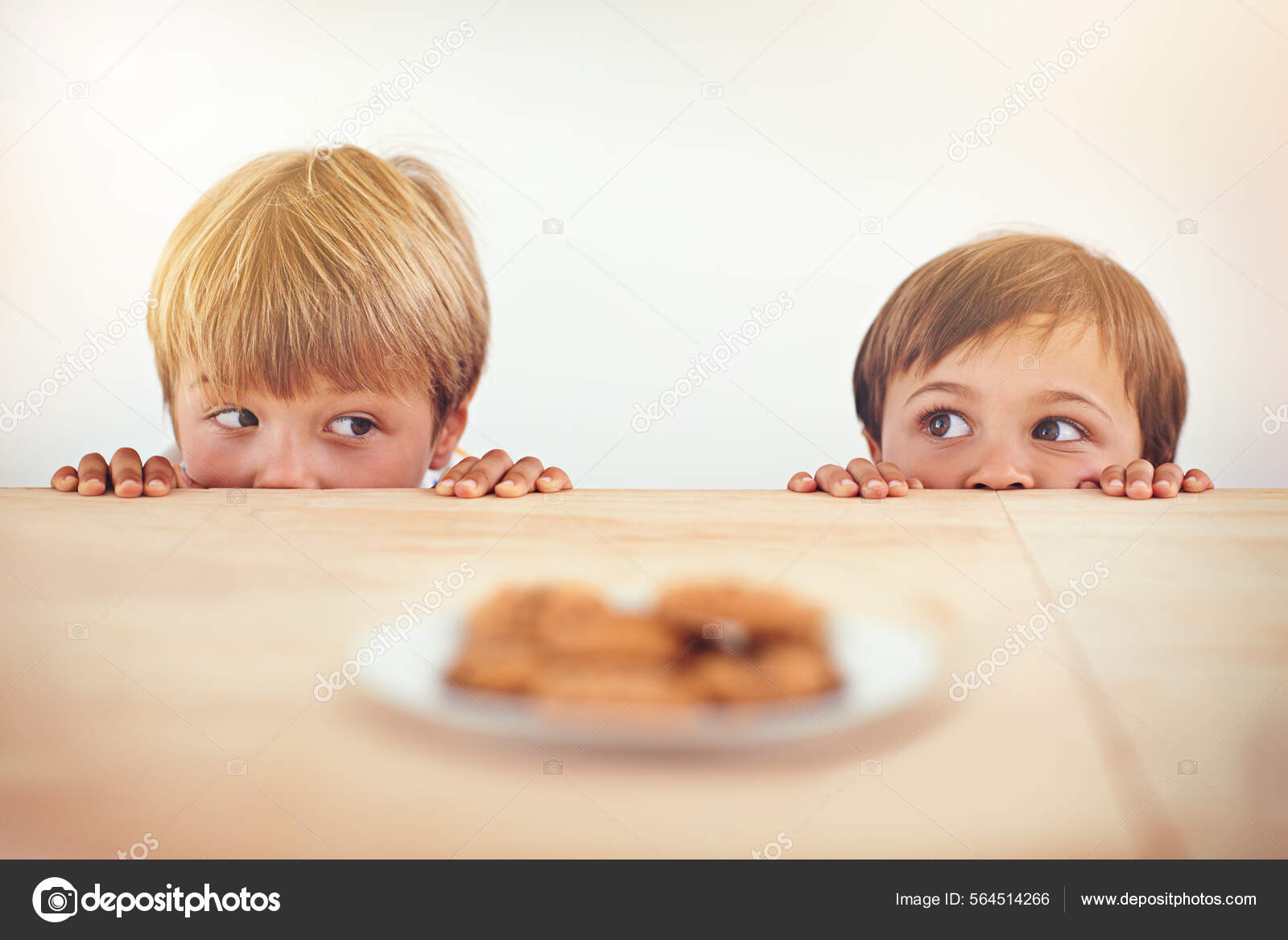 Who can resist a cookie. Two little boys sneakily trying to take a ...