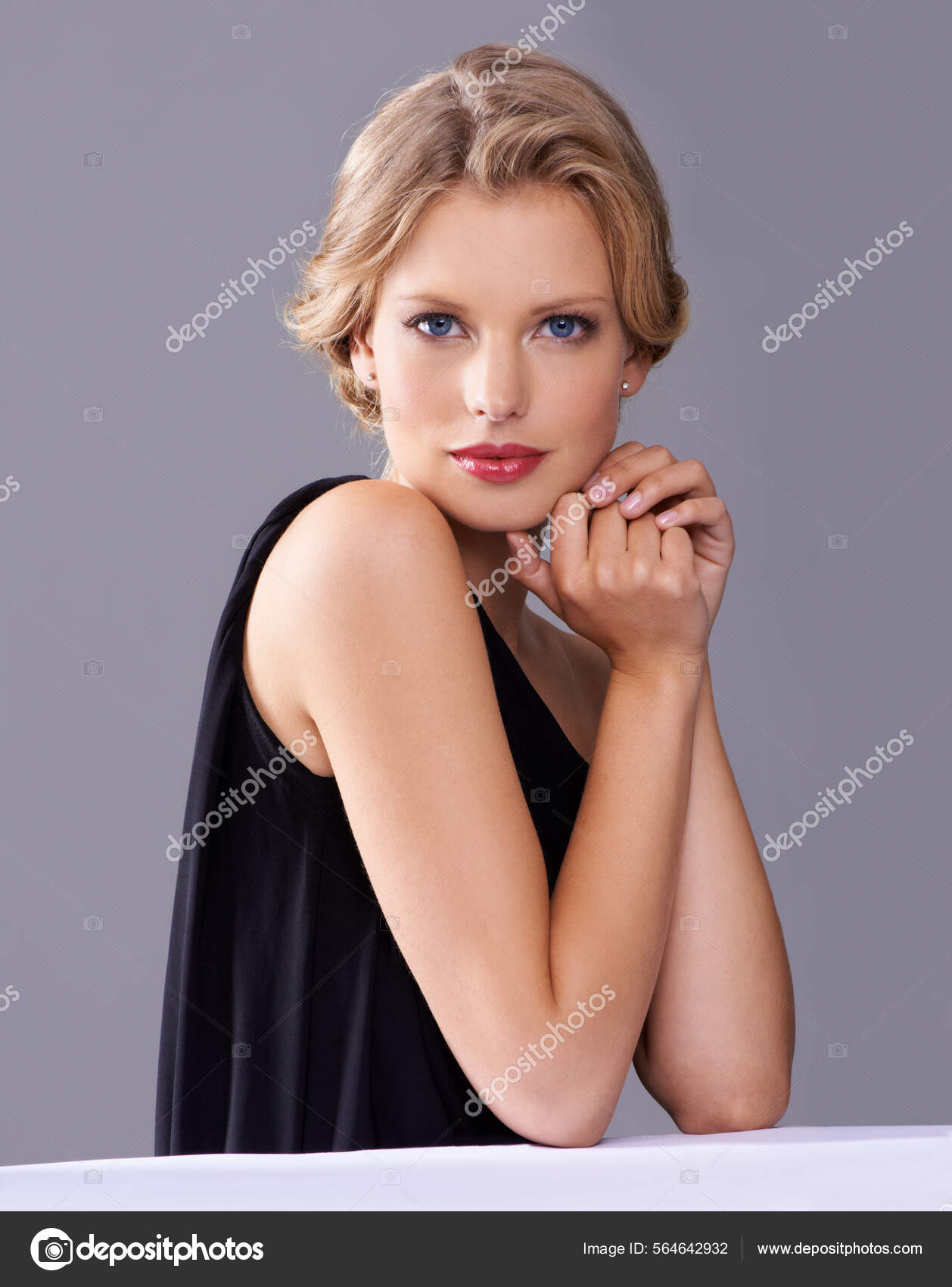 Every Woman Needs A Touch Of Glamour A Gorgeous Young Woman In An Evening Gown While Isolated