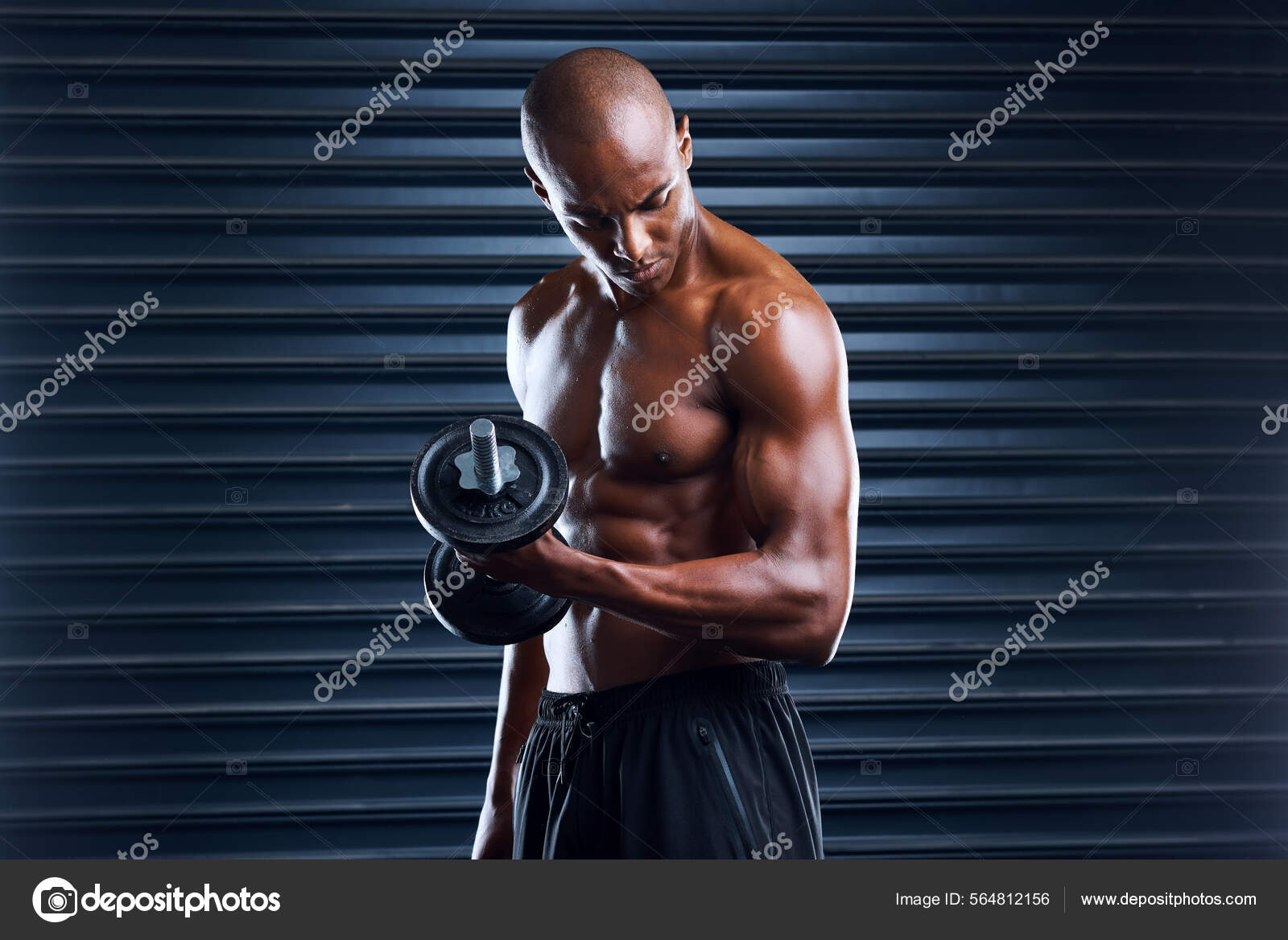 Its ok to be obsessed with yourself. Shot of a sporty young man working ...