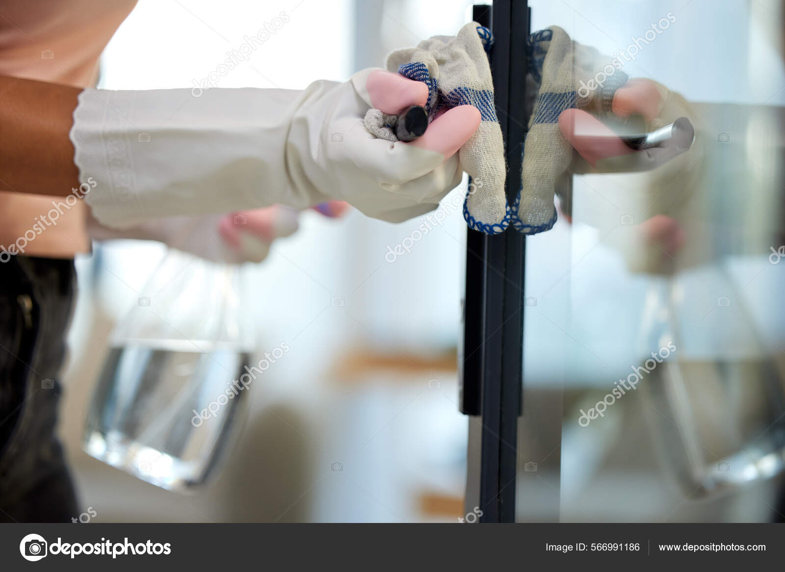 Everyone touches the handles. Shot of an unrecognizable person cleaning ...
