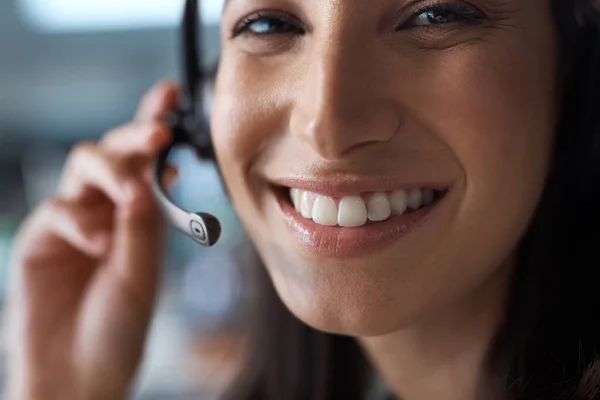Portrait of a young woman using a headset in a modern office - Stock ...