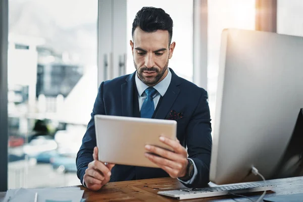 a handsome male executive working in a modern office. - Stock Image ...