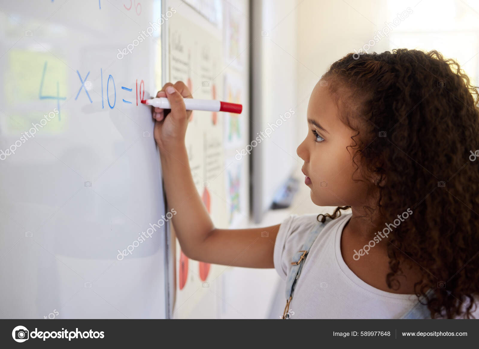 Little Girl Doing Maths Board Classroom Stock Photo by ©PeopleImages ...