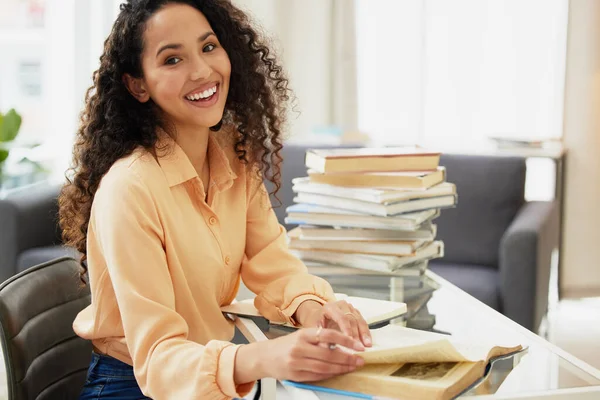 She is determined to succeed. a beautiful young woman studying from ...
