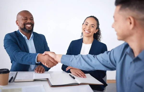 Team of smiling diverse business people shaking hands in office after ...