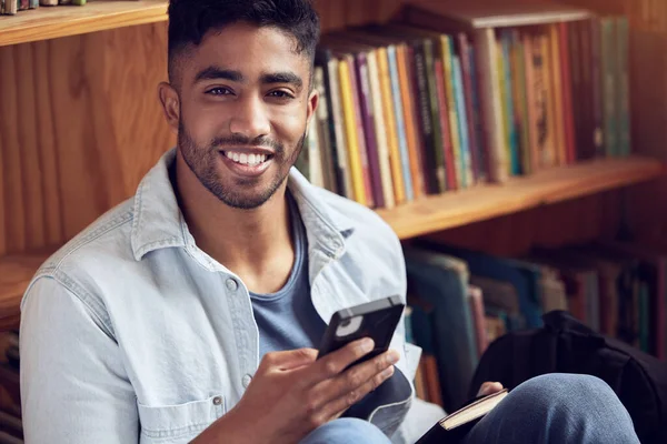 Tech that takes you to a higher level of learning. a young man using a ...