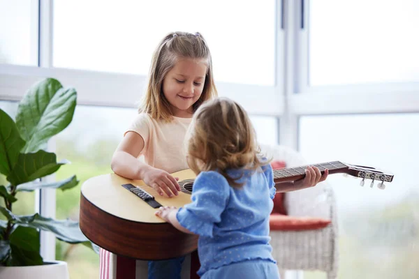 This is so much fun. two little sisters playing the guitar at home ...