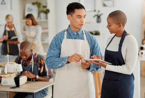 Entrepreneurs planning and discussing booking for sewing lessons on a ...