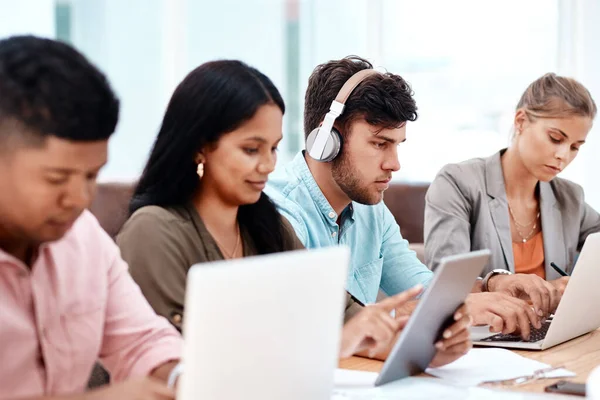 Wireless is the only way to work. a group of young business colleagues ...