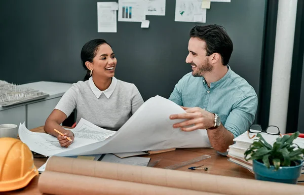 Leave the creative minds to work at it. two architects working with ...