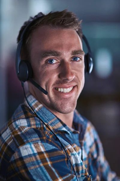 Happy call center agent smiling, ready to help a client on a phone call ...
