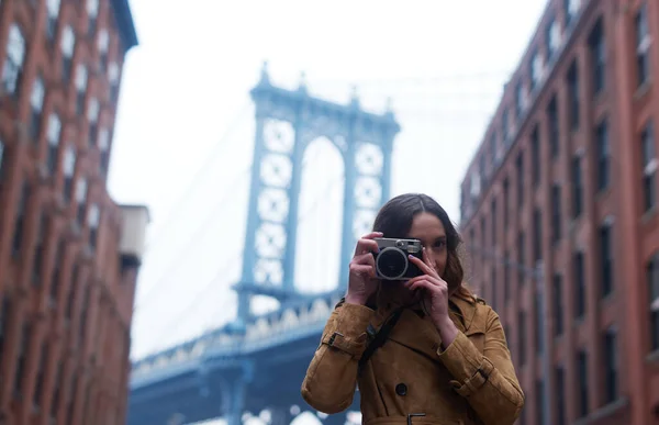 Dont miss out on a single memory. Portrait of an attractive young woman ...