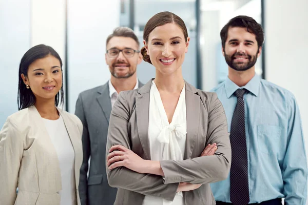 Trust the experts. Portrait of a group of businesspeople standing ...