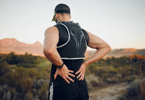 Muscle, injury and back pain after a workout or running outdoor. Man ...