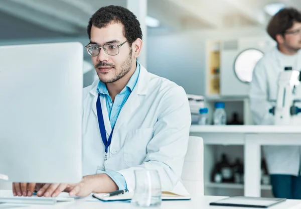Exploring the unknown through science. a young scientist working on a ...
