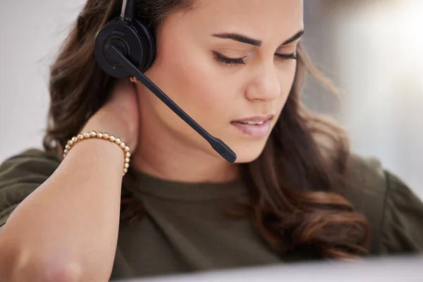 Shes been fielding calls for too long. a young call centre agent ...