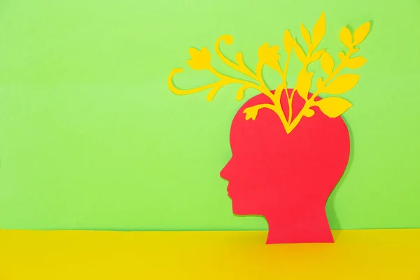 red paper head with paper flower branching, creative idea creation ...