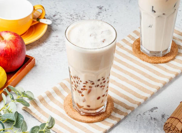 Pearl milk tea Boba / Bubble tea in glass jar on mat with grey ...