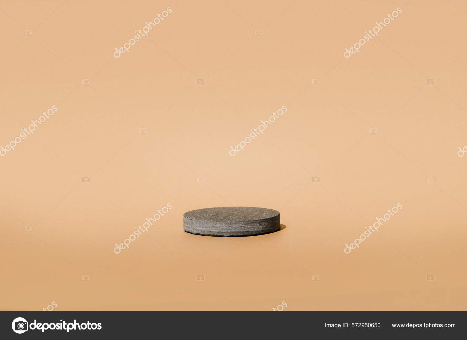 Beauty products display, grey stone podium on pastel beige background ...