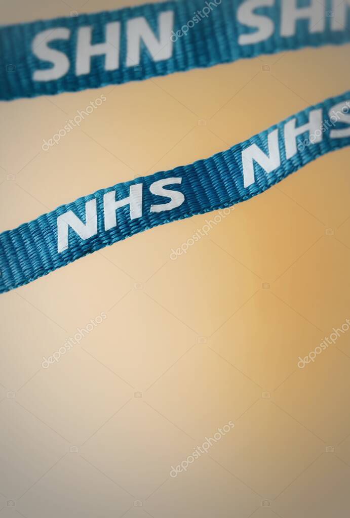 10 January 2022, England UK- NHS service logo on a id band.The National ...