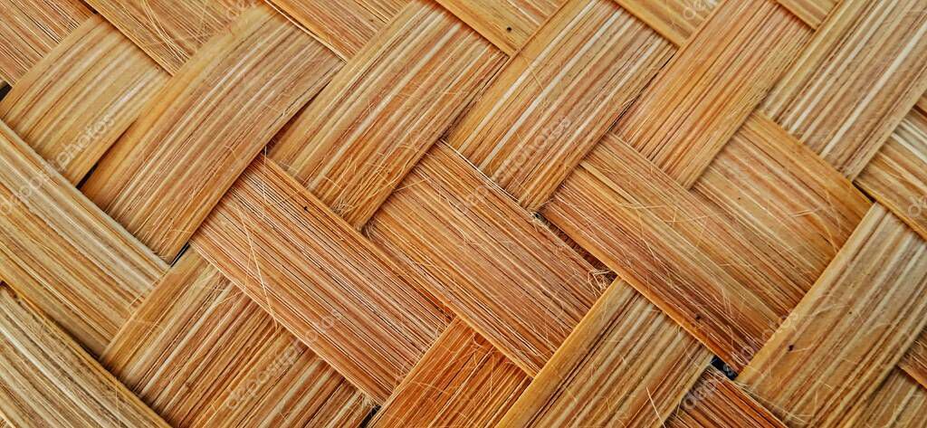 Textura de tejido de bambú naranja o fondo de patrón de tejido de bambú ...