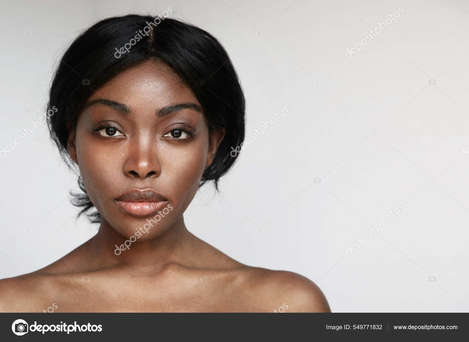 Beautiful black woman with clean healthy skin posing on white ...