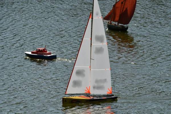 scale model of remote-controlled boats on a pond - Stock Image - Everypixel