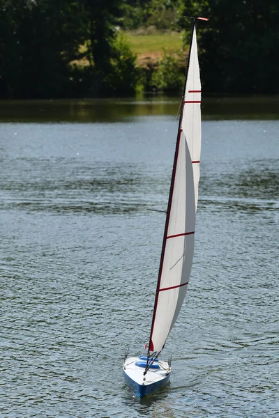 scale model of remote-controlled boats on a pond - Stock Image - Everypixel