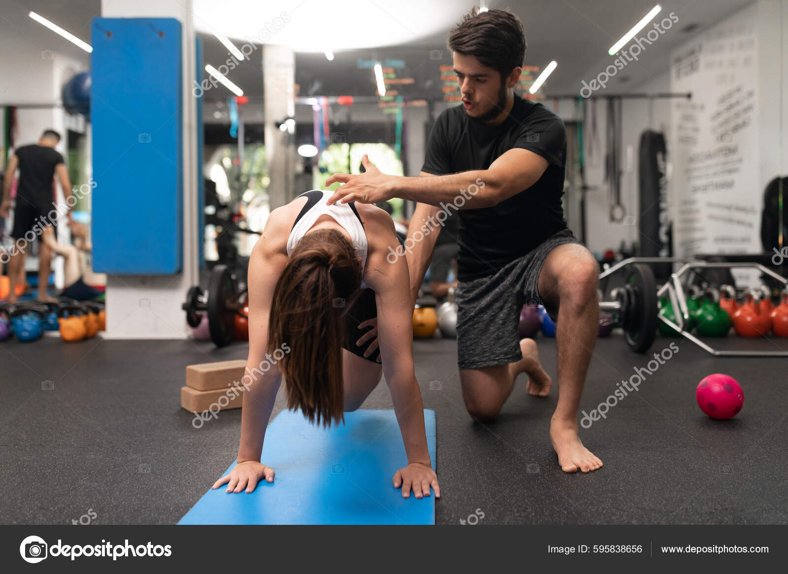 Coach Correcting Posture Female Trainee Training Session Gym Stock ...