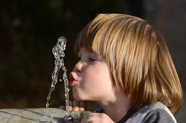 Child spitting water Stock Photos, Royalty Free Child spitting water Images | Depositphotos