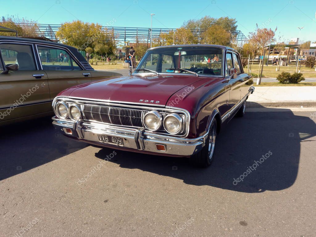 Old red Ford Falcon sedan family car from the early 1970s. Front view ...