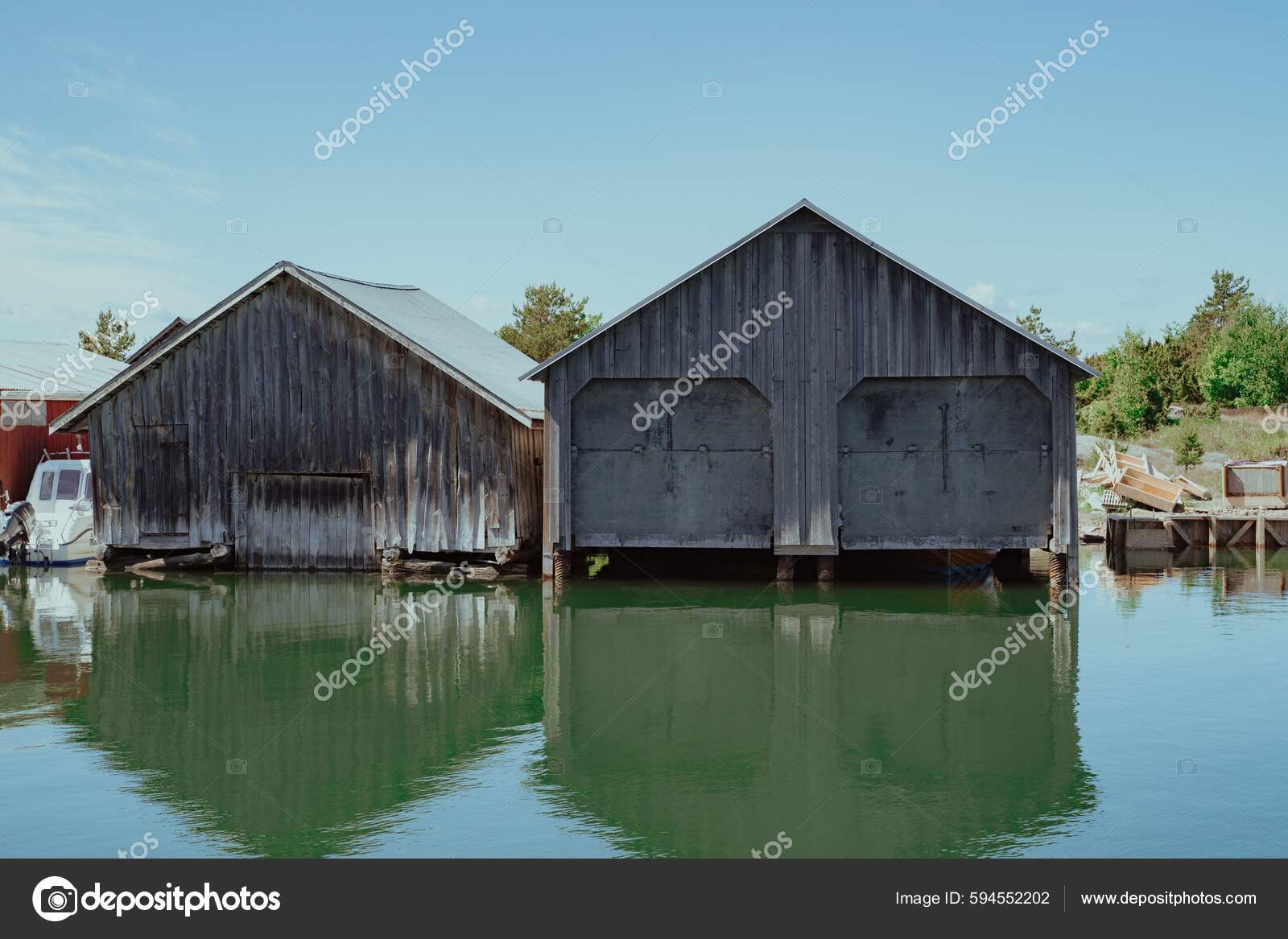 Pond Wooden Huts — Stock Photo © wirestock_creators #594552202
