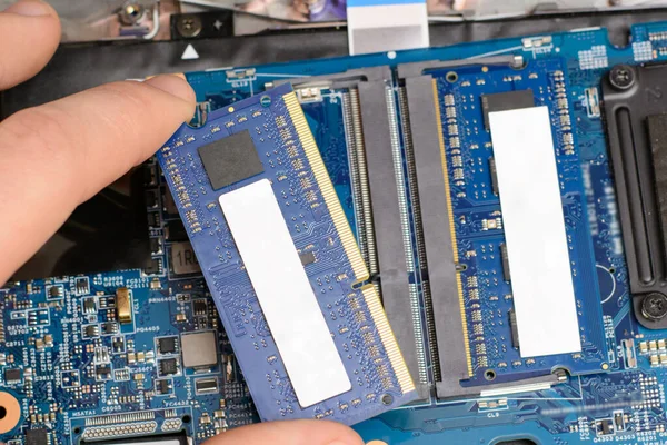 Changing RAM chip on a laptop. Upgrading laptop by adding fast DDR ...