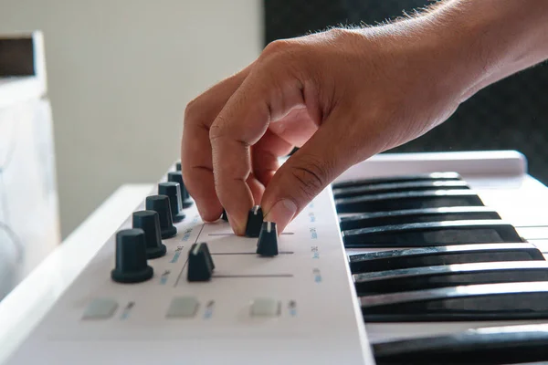 Hand in a keyboard. Close up of a hand configurating a black and white ...