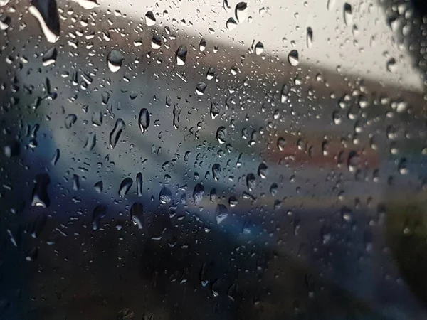 Water droplets on surface of car glass window. Car wash concept ...