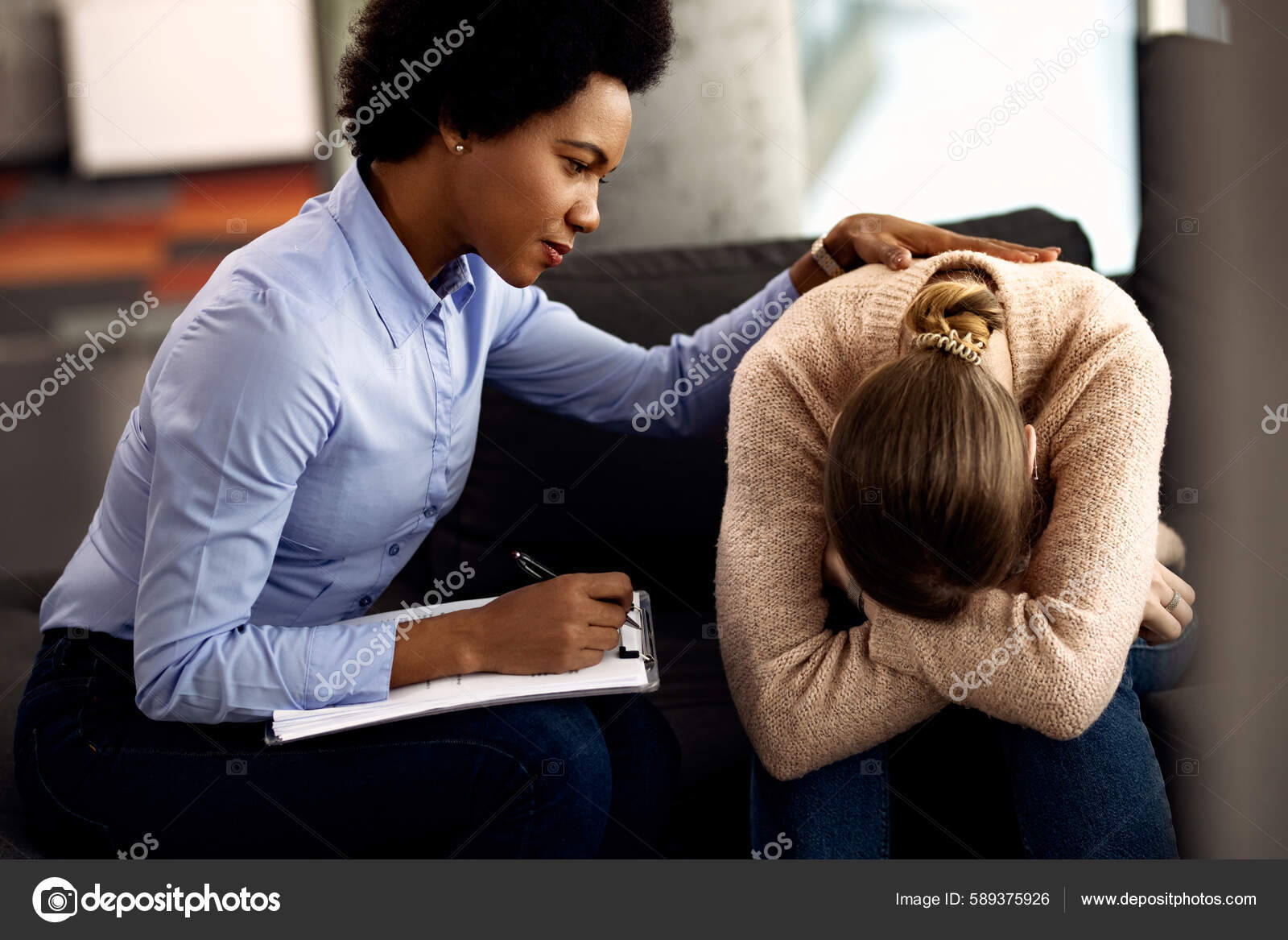 Supportive African American Psychotherapist Comforting Depressed Woman ...