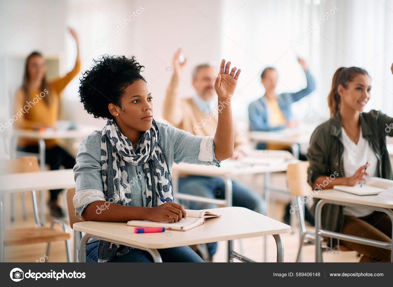 African American Mid Adult Woman Her Classmates Raising Hands Answer ...