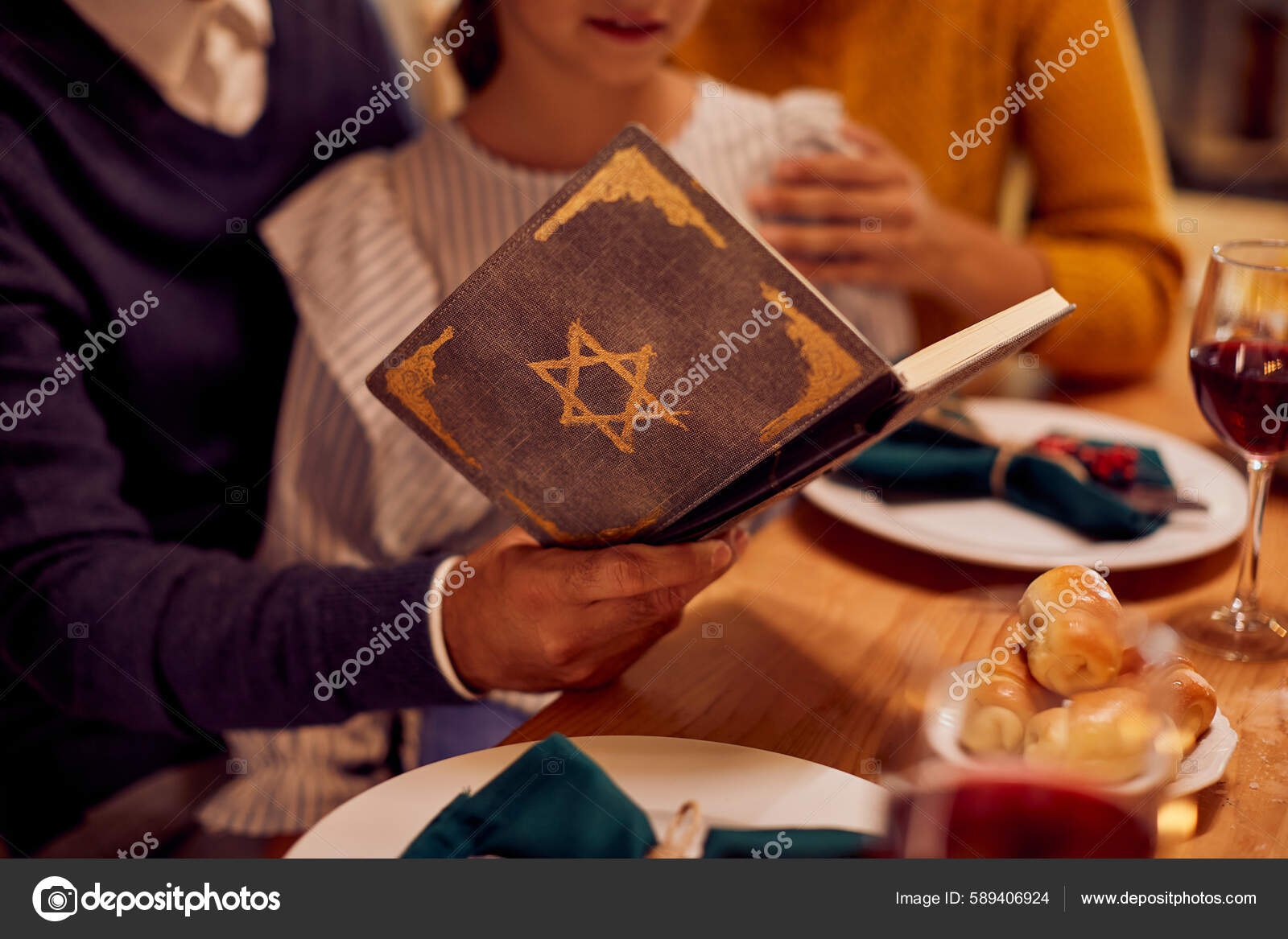 Close Offamily Reading Hebrew Bible Traditional Hanukkah Meal Dining ...