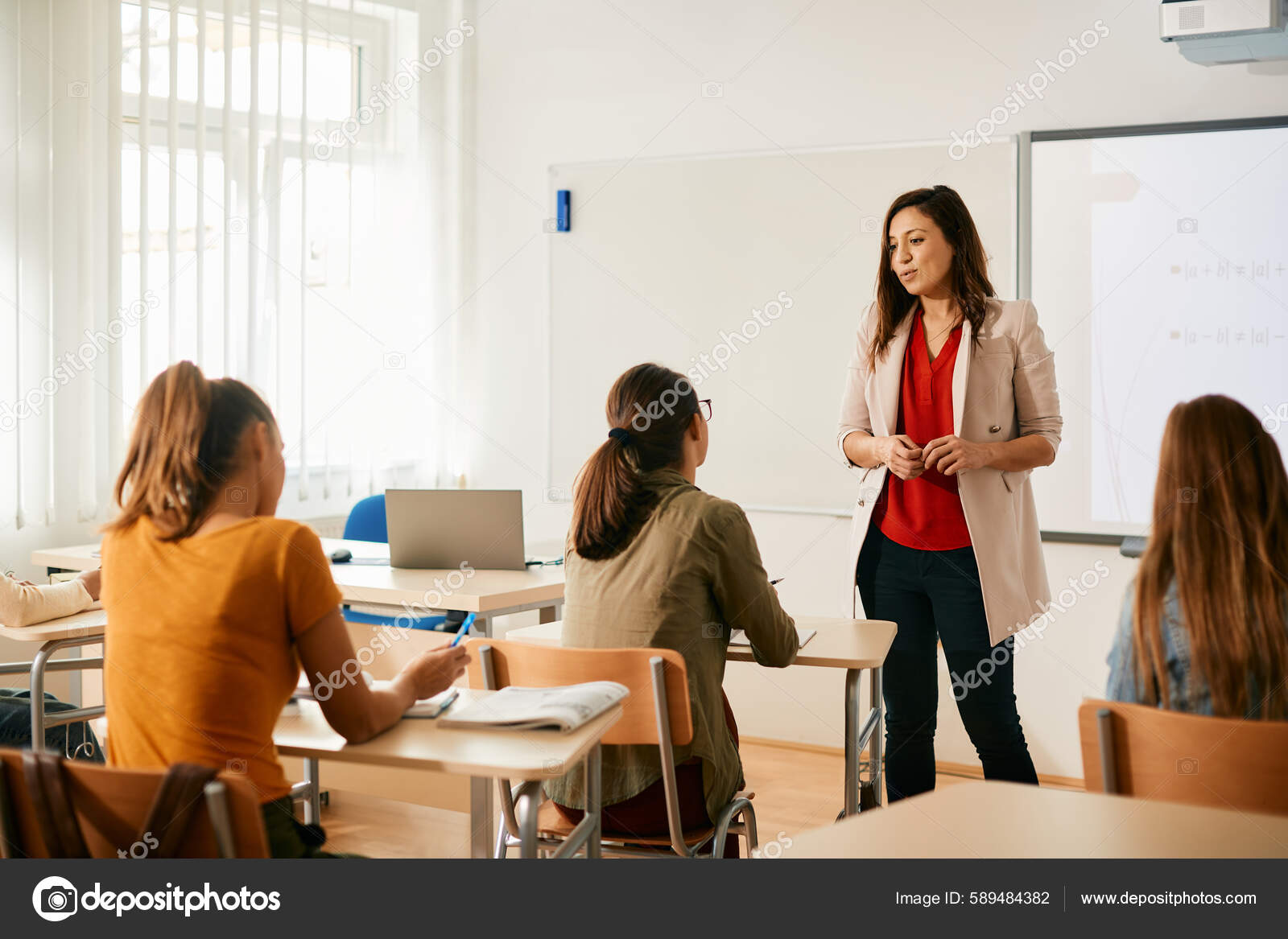 Students Talking In Class While Teacher Is Talking