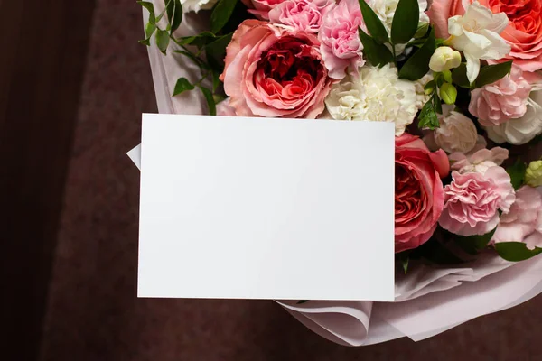 bouquet of flowers and a card from the sender. unknown admirer. Roses ...