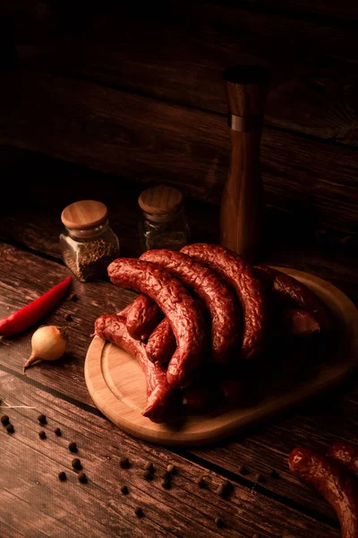 Top view of sausage, on a wood background. Traditional meat sausage, a ...