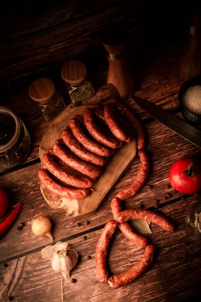 Top view of sausage, on a wood background. Traditional meat sausage, a ...