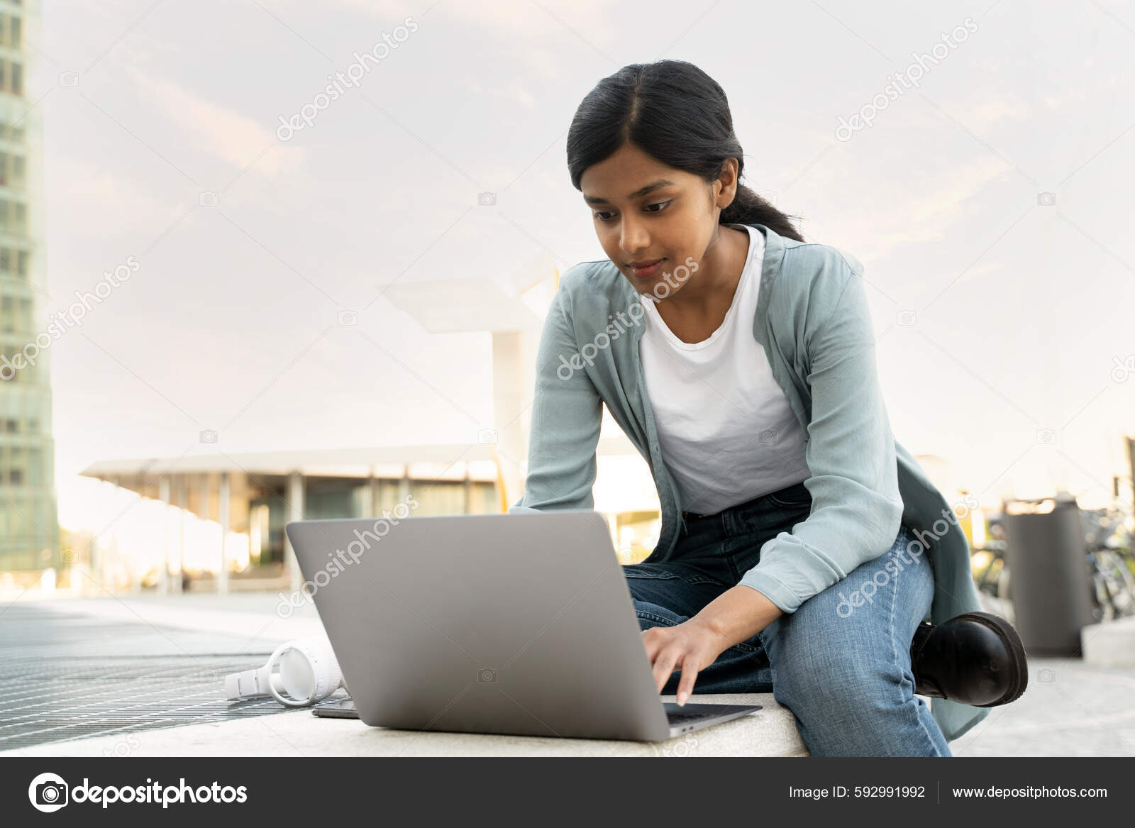 Pensive Indian Student Using Laptop Computer Studying Exam Preparation ...