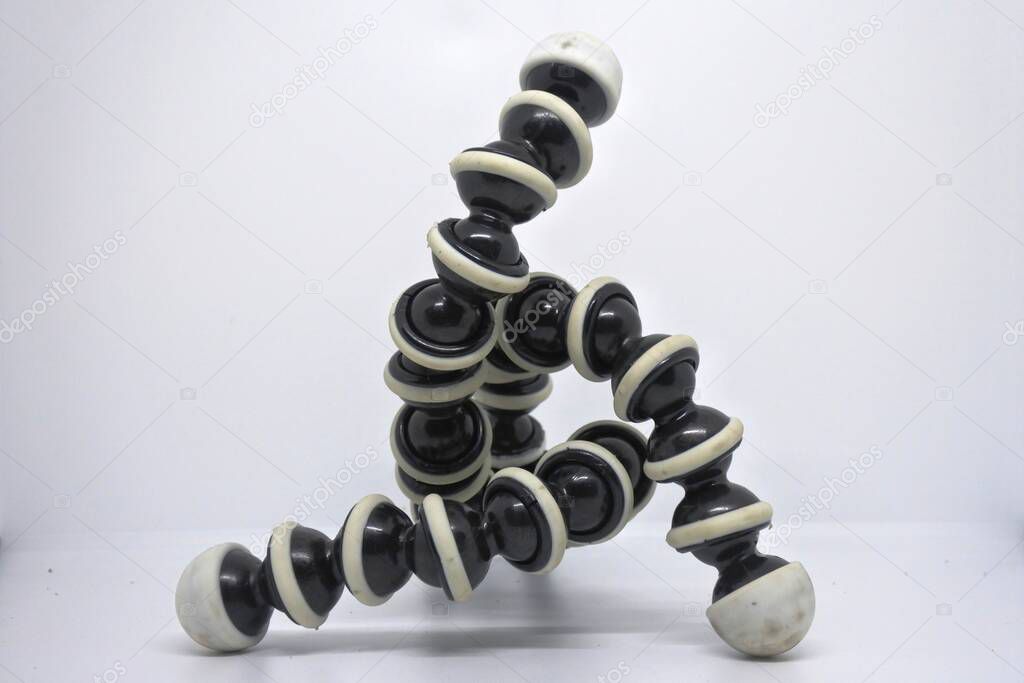 the gorilla pod or octopus tripod which is made of plastic material and ...