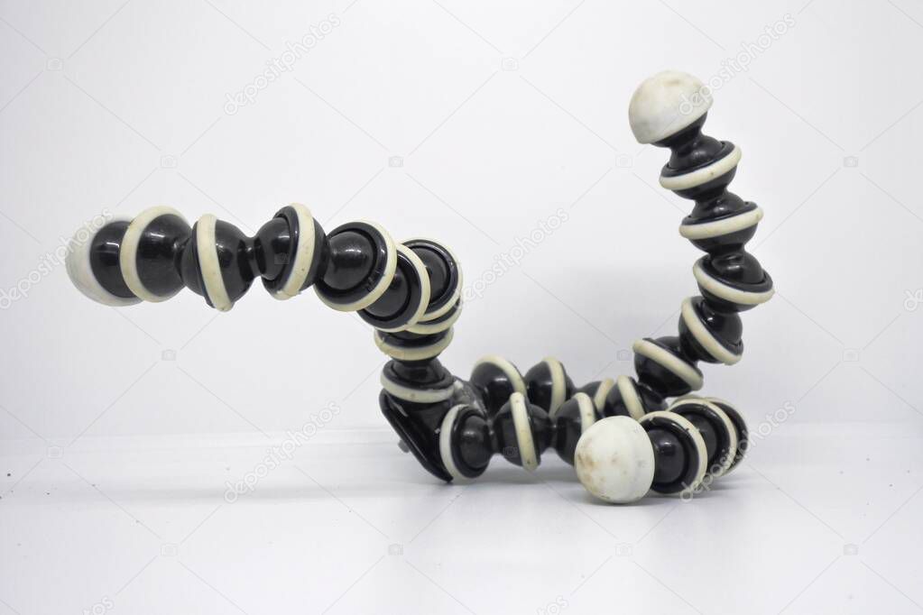 the gorilla pod or octopus tripod which is made of plastic material and ...