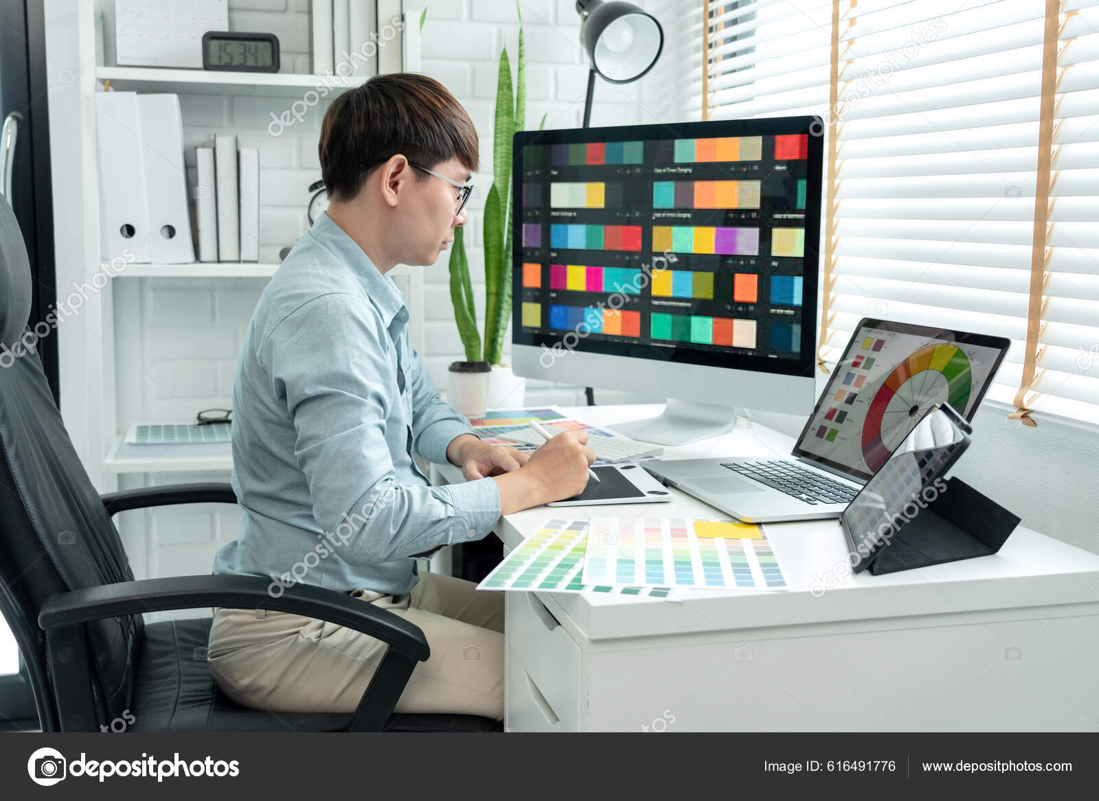 Male Graphic Designer Choosing Color Swatch Samples Multiple Screens ...
